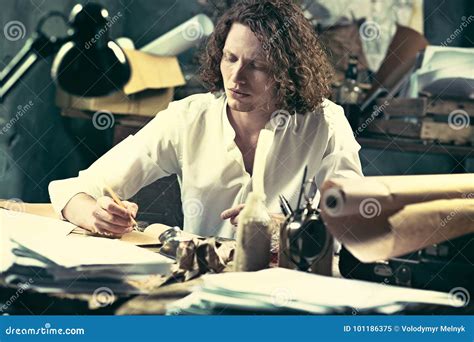 Writer At Work Handsome Young Writer Sitting At The Table And Writing