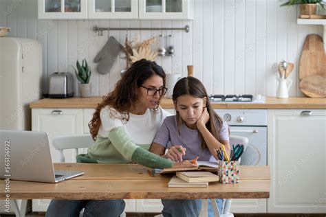 Young Mother Teaching Teen Girl Daughter At Home Mom Helping Sad