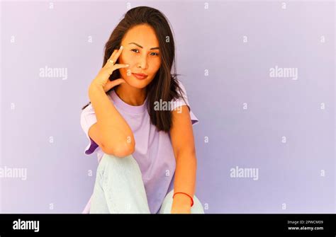 Full Body Of Positive Barefoot Millennial Asian Female In Casual Shirt