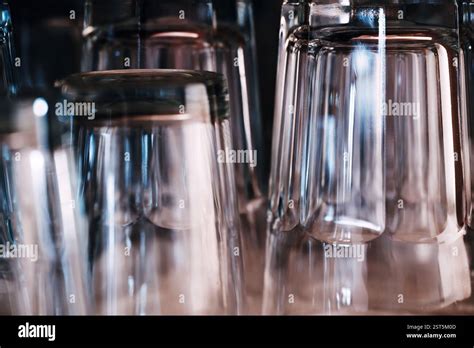 Set Of Empty Clean Drinking Glasses On Kitchen Counter Top After