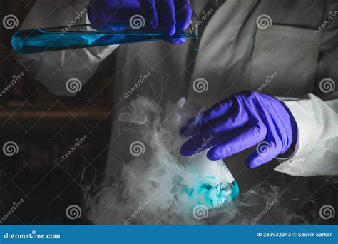 A Woman Scientist Performing Organic Reaction Under Fuming Condition In A Laboratory Stock Image
