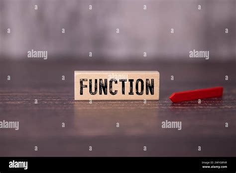 Text On Gray Word Function In Small Wooden Letters With Black Font On A Blue Background Stock
