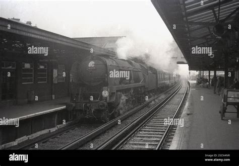 1950s Historical Steam Locomotive 30477 At A Railway Station England Uk The Lswr H15 Class