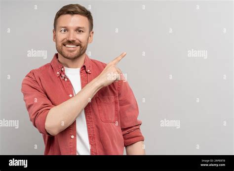 Amity Smiling Man Pointing Index Finger By Side On Copy Space For Amity Smiling Man Pointing Index Finger By Side On Copy Space For