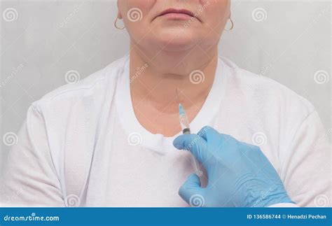 Doctor Makes A Patient Patient A Thyroid Biopsy On Suspicion Of