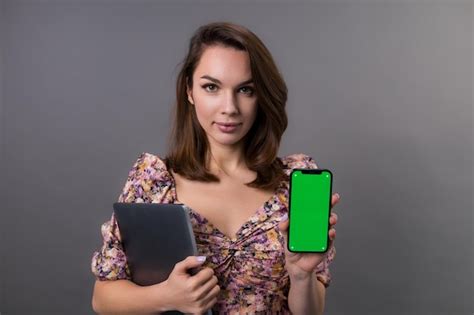 Premium Photo Portrait Of A Young Woman With A Laptop Holding A