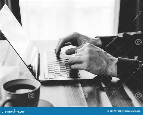 A Man Is Typing On A Laptop Keyboard Stock Photo Image Of Business Online 185747082