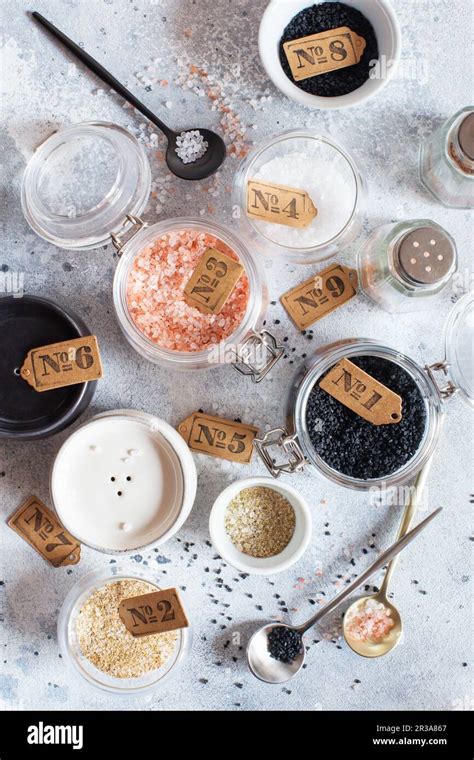 Mix Of Different Salt Types On Grey Concrete Background Sea Salts Black And Pink Himalayan