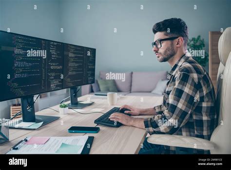 Photo Of Confident Busy Coder Dressed Eyewear Typing Application Modern Gadget Indoors Workplace