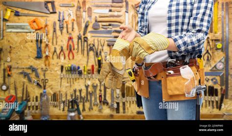 Woman Or Builder With Gloves And Working Tools Stock Photo Alamy
