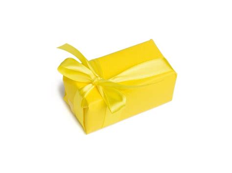 Premium Photo Rectangular Box With A T Wrapped In Yellow Paper And Tied With A Silk Yellow