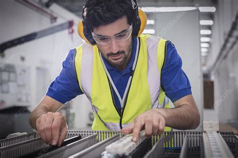 Male Engineer Assembling Equipment In Factory Stock Image F0300766