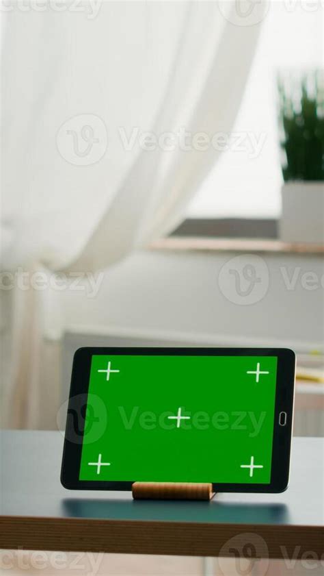 Two collegues talking about internet connection in front of tablet computer with mock up green ...