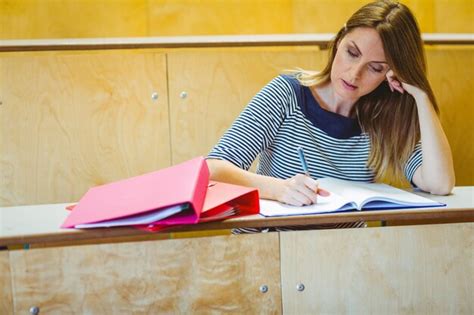 Premium Photo Mature Babe Taking Notes In Lecture Hall