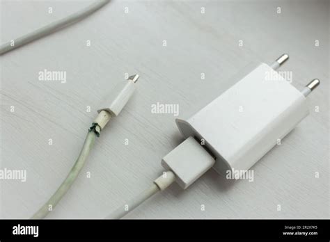 Electric Plug On White Background Broken Power Cord With Charger Broken Usb Cord Smartphone