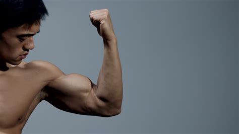 Male Fitness Model Stretches Arm Out His Arm And Flexes His Bicep 동영상 809052750 게티이미지뱅크