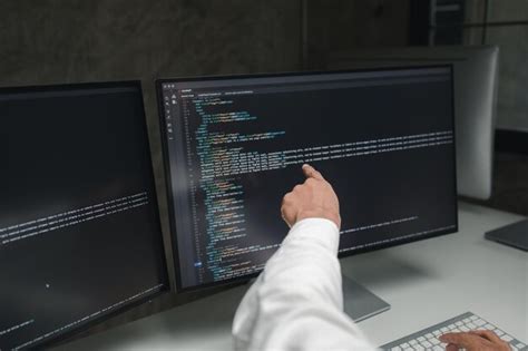 Premium Photo Programmers Write Programs On The Computer Designing