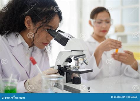 Portrait Of Beautiful Black Scientist Looking Under Microscope Stock Image Image Of Chemist