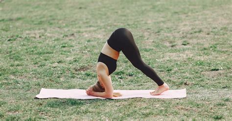 Flexible Barefoot Woman Doing Yoga Exercise On Green Lawn · Free Stock