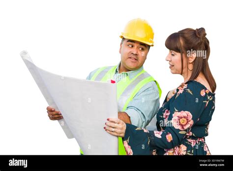Hispanic Male Contractor Talking With Female Client Over Blueprint
