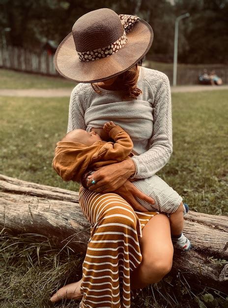 Premium Photo Woman Breast Feeding Portrait