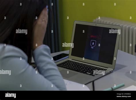 Businesswoman Looking Worried As An Error Message Appears On Her
