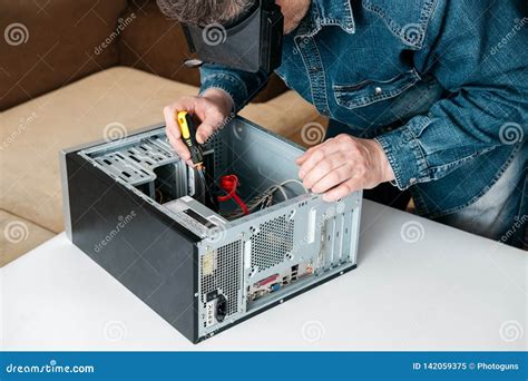 Repairman Is Disassembling Personal Computer Engineer Is Diagnostic And Fixing Broken Pc In