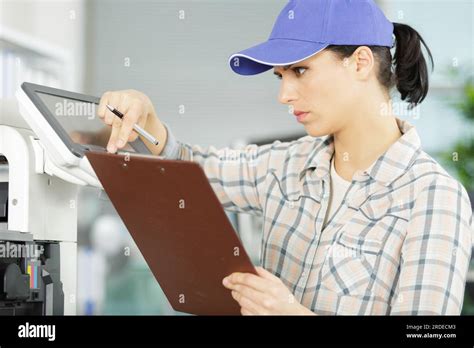 Woman Is Fixing A Printer Stock Photo Alamy