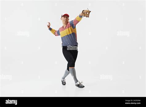 Full Length Image Of Young Guy Baseball Player In Serving Ball