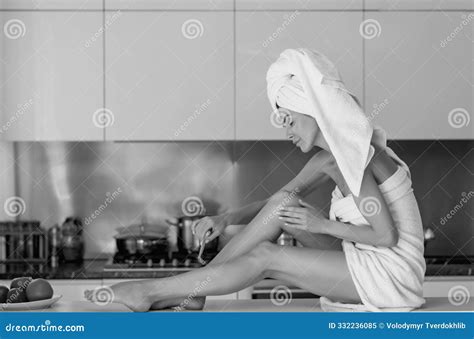 Woman Shaves Legs Hairy Legs Woman With Foam On Leg Hold Razor And