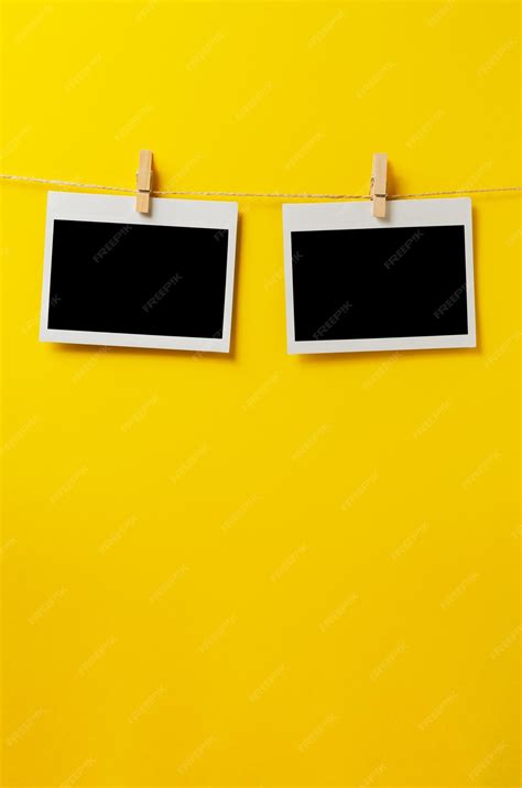 Premium Photo Empty Photos Hang On A Rope With Clothespins A Design