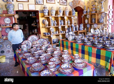 Clerk In A Shop Selling Colorful Talavera Pottery In The City Of Puebla