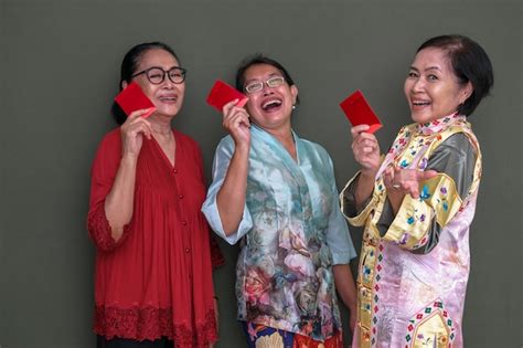 Premium Photo Three Sisters Celebrating Chinese New Year Each One