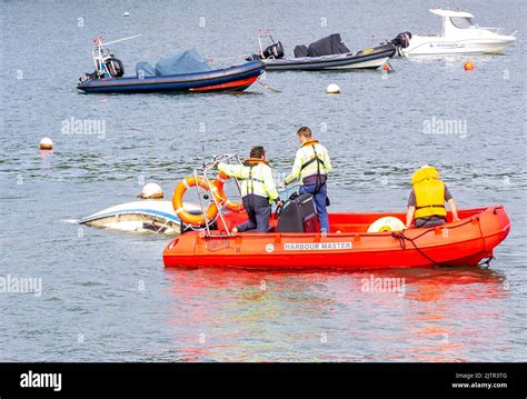 Local Harbour Master Removing Sunken Yacht Towing It Away From Mooring