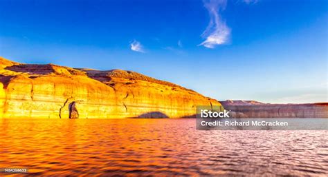 Beautiful View Of Sandstone Wall Reflection And Water At Lake Powell