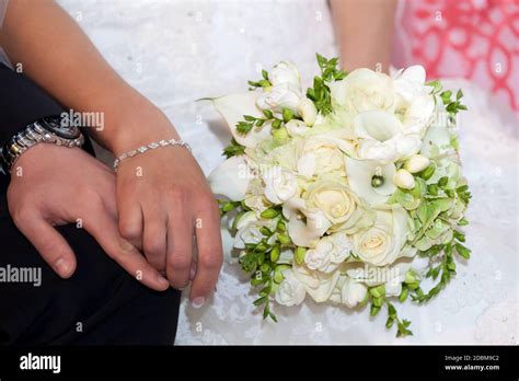 Bride And Groom Hold Their Hands Romantically Stock Photo Alamy