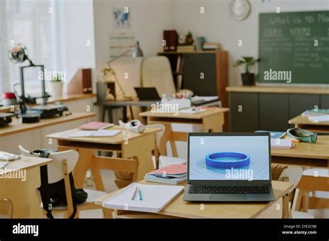 3d Printed Object Showcased On Laptop Screen Among School Supplies In