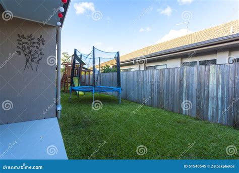 Trampoline In Backyard Stock Image Image Of Swing Swingset 51540545