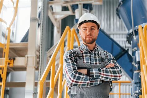 Engineer Is Indoors Construction Worker In Uniform Is In The Factory Stock Image Image Of