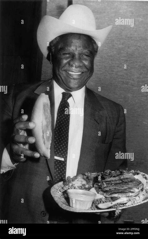 Chicago Mayor Harold Washington Displays The Moonachie Cheeze Sandwich That He Won In A Bet With