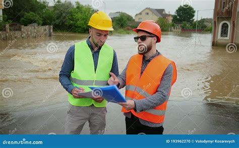 Two Male Engineers Solve The Flood Problem Natural Disaster Major Flooding Stock Footage