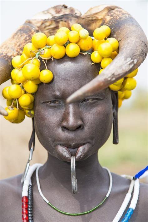 Africa Portrait Of A Mursi Woman Wearing A Traditional Headdress Lip