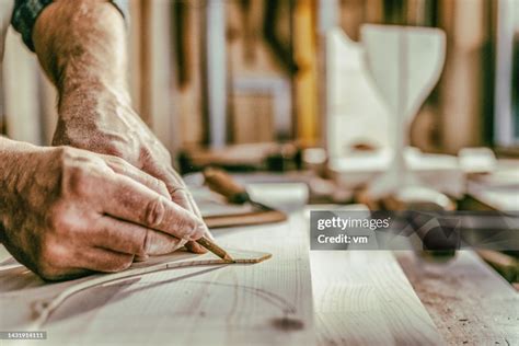 Craftsman Drawing Shapes On Material Using Template High Res Stock