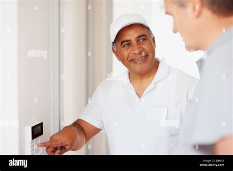 Man Demonstrating How Alarm System Works Stock Photo Alamy