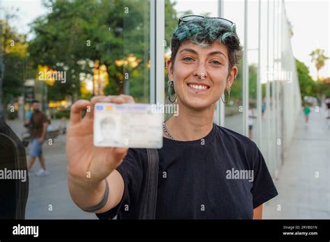 Smiling Non Binary Gender Showing Their Id Identity Document In Lgbt Community Queer And Gay