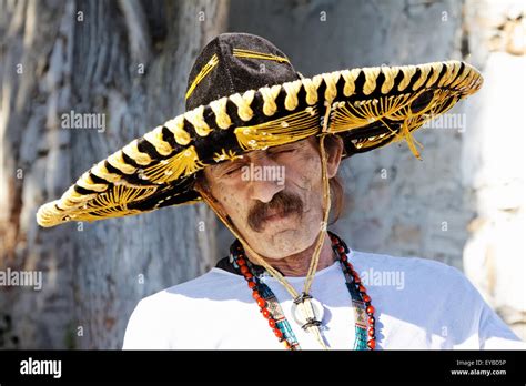 Mexican Wearing Sombrero And Poncho