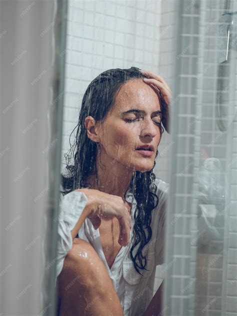 Premium Photo Attractive Woman Under Water Stream In Shower