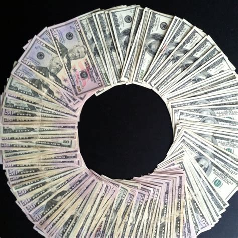 Circle Of Twenty Dollar Bills On Black Background