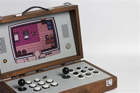 This Sleek Limited Edition Wooden Arcade Briefcase Plays 100 Classic Games Maxim