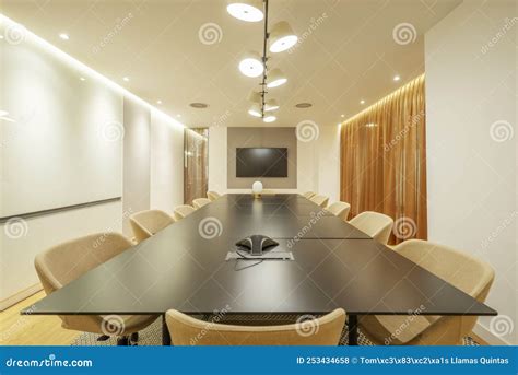 Boardroom With Long Table Chairs And Dry Erase Markers For Brainstorming Sessions Stock Image